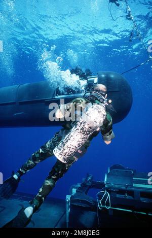 A Mark 8 special dive vehicle (SDV) in the beginning stage of recovery ...