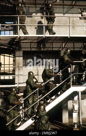 Fire fighting students equipped with A-4 oxygen breathing apparatuses ...