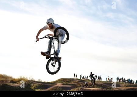 BMX and mountain bike riders in action at Fleet BMX and pump track in ...