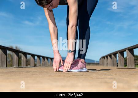 close up of sporty woman touching her back Stock Photo - Alamy