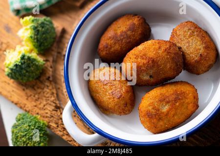 Broccoli croquette. The croquette is a portion of dough made from a ...