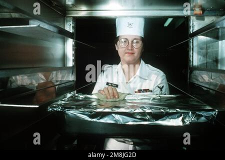 Mess SPECIALIST Third Class (MS3) Tim Martin makes bread dough in the ...