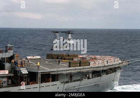 A crewman on board the aircraft carrier USS Saratoga (CV-60) fights the ...