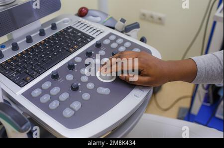 Hand of doctor lies on control panel of ultrasound device Stock Photo ...