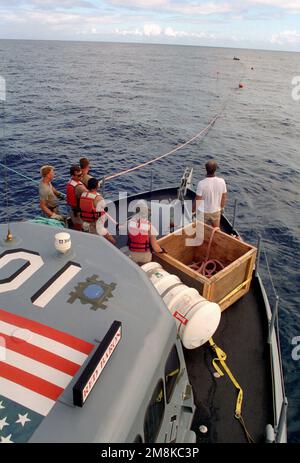 Members of Underwater Construction Team Two (UCT-2) prepare to dive and ...