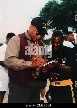 Heavyweight boxing champion George Foreman is pictured preaching ...