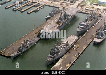 An aerial view of a section of Naval Station showing piers 5 and 6 ...