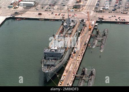 An aerial view of a section of Naval Station showing piers 5 and 6 ...