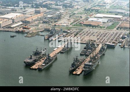 An aerial view of a section of Naval Station showing piers 5 and 6 ...