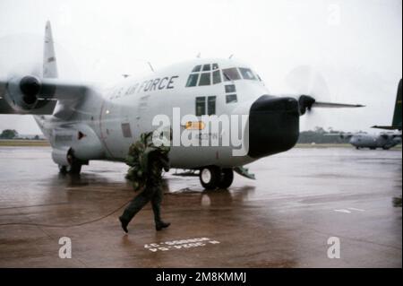 A WC-130 Hercules aircraft from the 54th Weather Reconnaissance ...