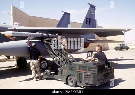 Air Force weapons loaders from the 28th Air Expeditionary Wing, use MJ ...