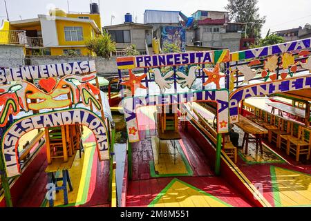Colorful painted trajinera boats waiting for tourists to travel the ...
