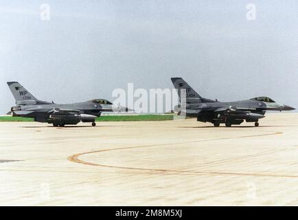 Right side view of an F-16 Fighting Falcon aircraft, armed with an AIM ...