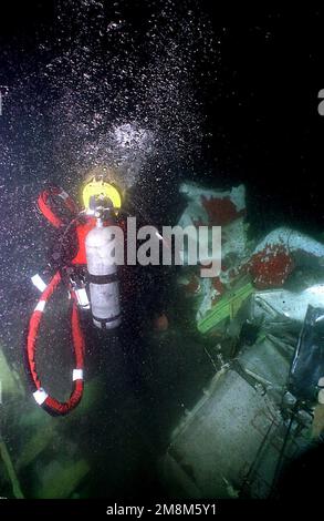 US Navy Crash and Salvage Rescue Team carries an injured sailor on a ...