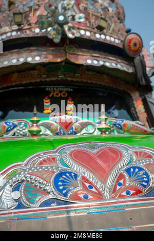 Detail of front decorations of a colorfully painted bus, Peshawar ...