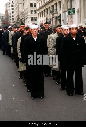 A U.S. Marine and joint service members provide a cordon along ...
