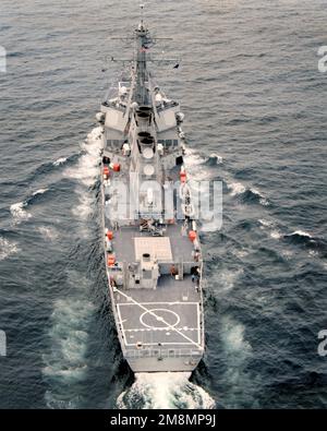Aerial high oblique stern-on view of the guided missile destroyer USS ...