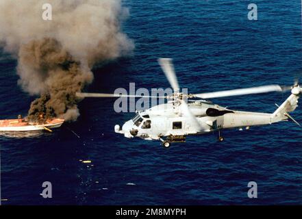 An AGM-114 Hellfire training missile sits in its container at a ...