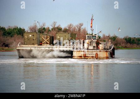 A U.S. Army Landing Craft Mechanized aproaches with a Marine Joint ...