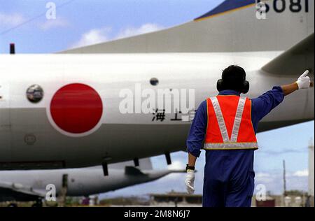 A ground crew gives the "thumbs up (she's ready)" sign to ***** a ...