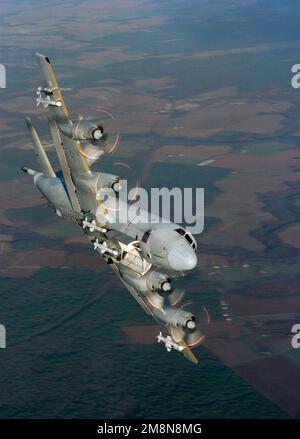 A view of a Harpoon missile on the right wing of a P-3 Orion aircraft ...