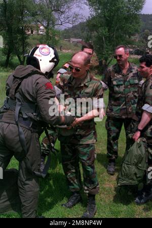 ADM Ellis, Commander Joint Task Force Nobel Anvil, receives a survey of ...