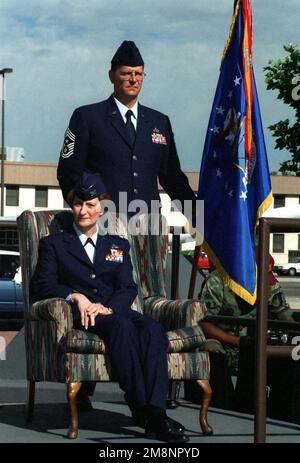 A command chief master sergeant stands during the presentation of the ...