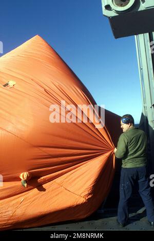 An inflatable target called a "Killer Tomato" floats after it was ...