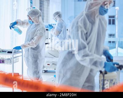 Biohazard team cleaning a medical hospital. Csi team in hazmat suits ...