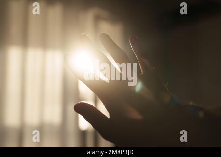 Abstract man hand playing with sunset light indoor, shallow focus Stock ...