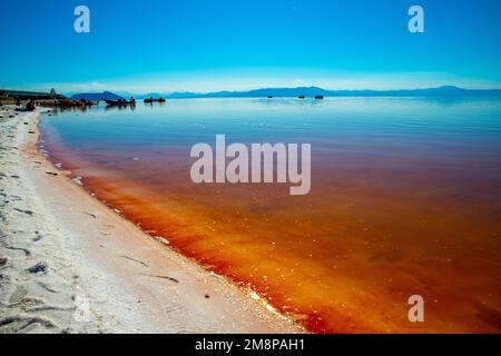 A scenic view of Lake Urmia in Iran under a cloudless blue sky on a ...