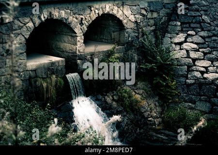 An old stone dam with arch holes Stock Photo - Alamy