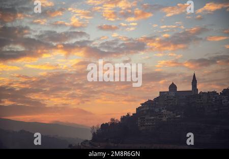 Mountainous Church over Sunset Sky Background Stock Photo - Alamy