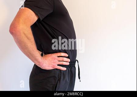 Lordosis curvature of the spine. Man with lordosis. A common body ...