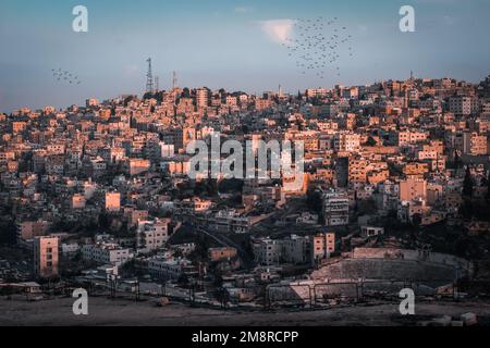 Downtown Amman landscape at sunset, capturing the golden hour sunlight ...