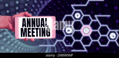 Hand writing sign Annual Meeting. Word Written on Yearly gathering of ...