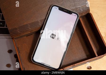 Kiev, Ukraine - January 12, 2023: the phone lies on a laptop with an ...
