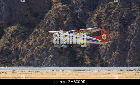 A ski plane taking off at Mount Cook Airport with tourists on a scenic ...