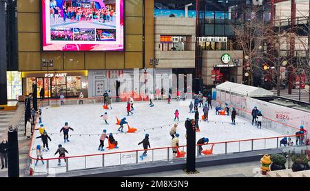 SHANGHAI, CHINA - JANUARY 15, 2023 - People and children skate at an ...