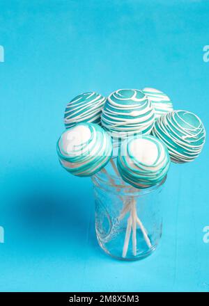 Teal and white cake pops Stock Photo - Alamy