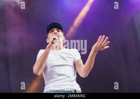 The singer and rapper Morad singing at the concert, 2021 Share Festival ...