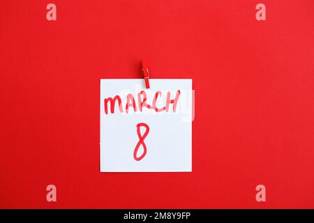 Women's Day 8 March. Calendar with 8 March, hanging 3D gift box, hearts ...