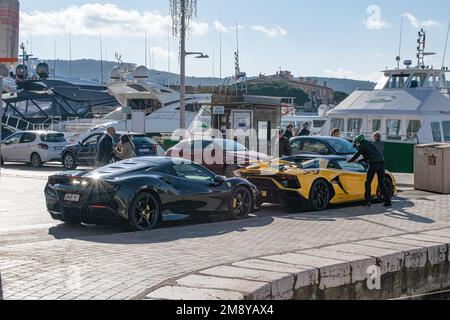 Saint Trope harbor with luxury cars on the dock Stock Photo - Alamy
