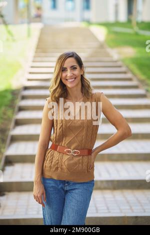Stylish Woman standing on steps Stock Photo - Alamy