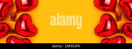 Frame made of red inflatable foil balloons in a heart shape. Concept on ...