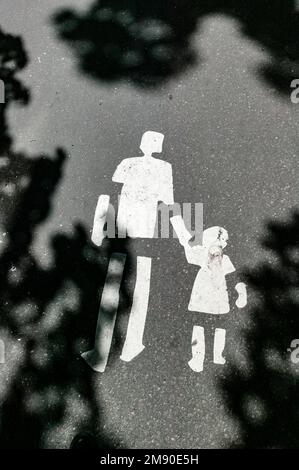 Family Pedestrian Sign on Pavement Stock Photo - Alamy