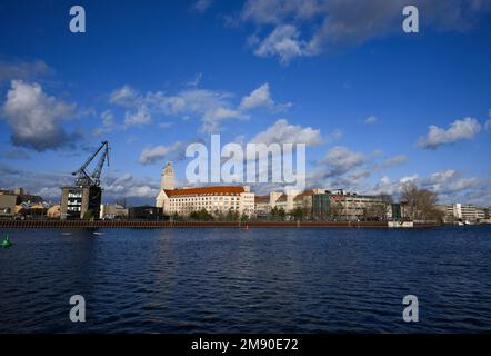 Berlin, Germany. 13th Jan, 2026. A man walks along the frozen Spree ...