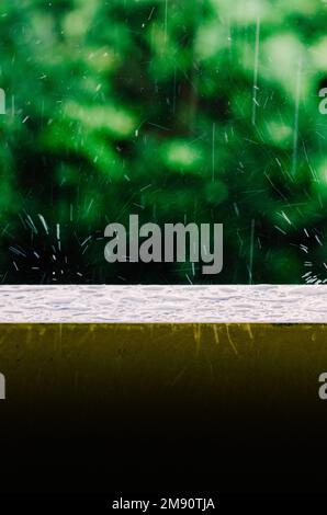 Raindrops falling onto a water surface Stock Photo - Alamy