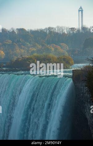 A vertical aerial shot of Niagara Falls and a cruise for tourists ...