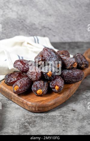 Jerusalem date fruit on stone background. Huge date fruit in a coconut ...